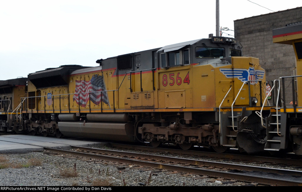 UP SD70ACe 8564 trails on 211